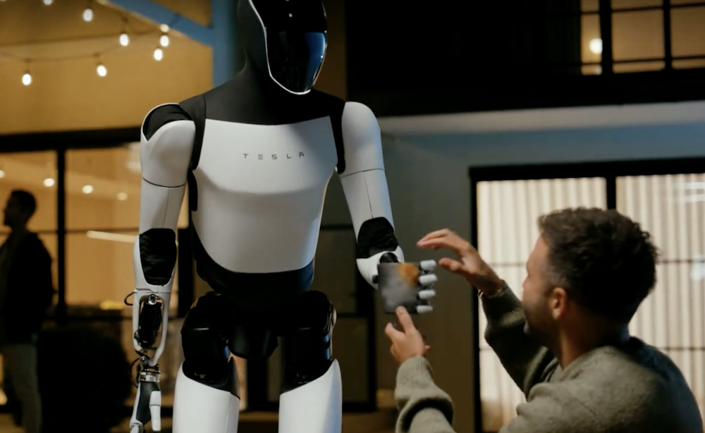 Tesla's Optimus robots serve drinks